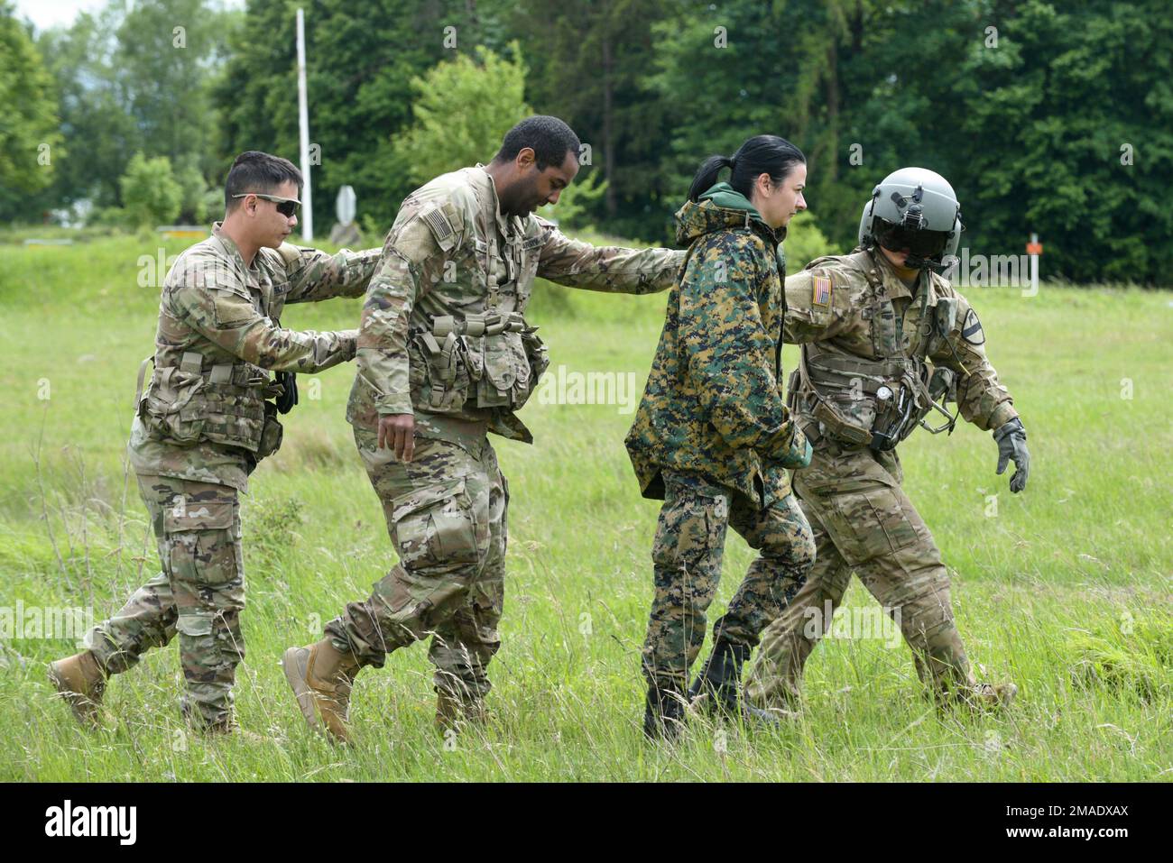 U.S. Soldiers and a Bosnian soldier conduct medical evacuation training ...