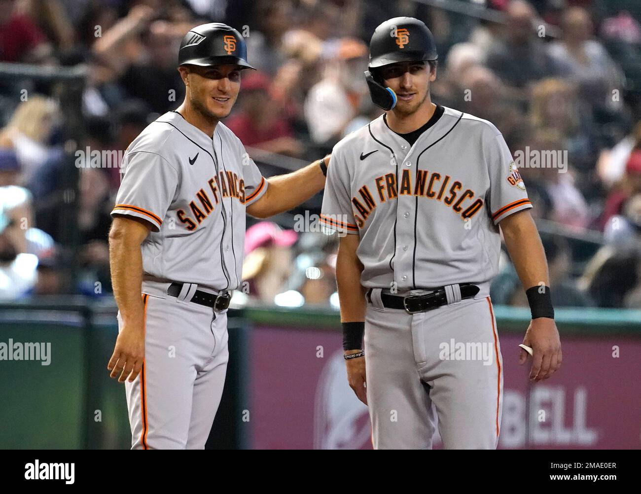 San Francisco Giants third base coach Mark Hallberg, left ...