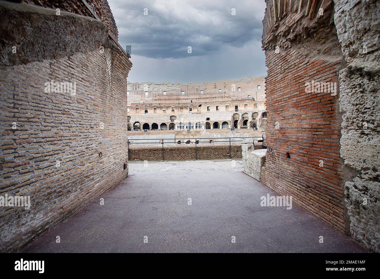 The Colosseum in Rome with dark clouds Stock Photo - Alamy