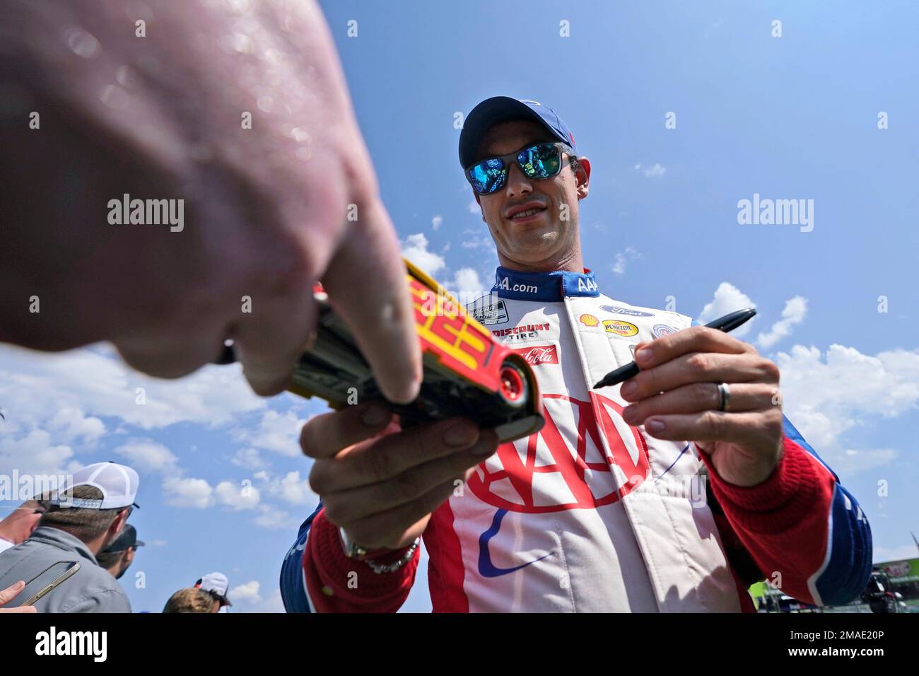 Joey Logano gives autographs before a NASCAR Cup Series auto race at ...