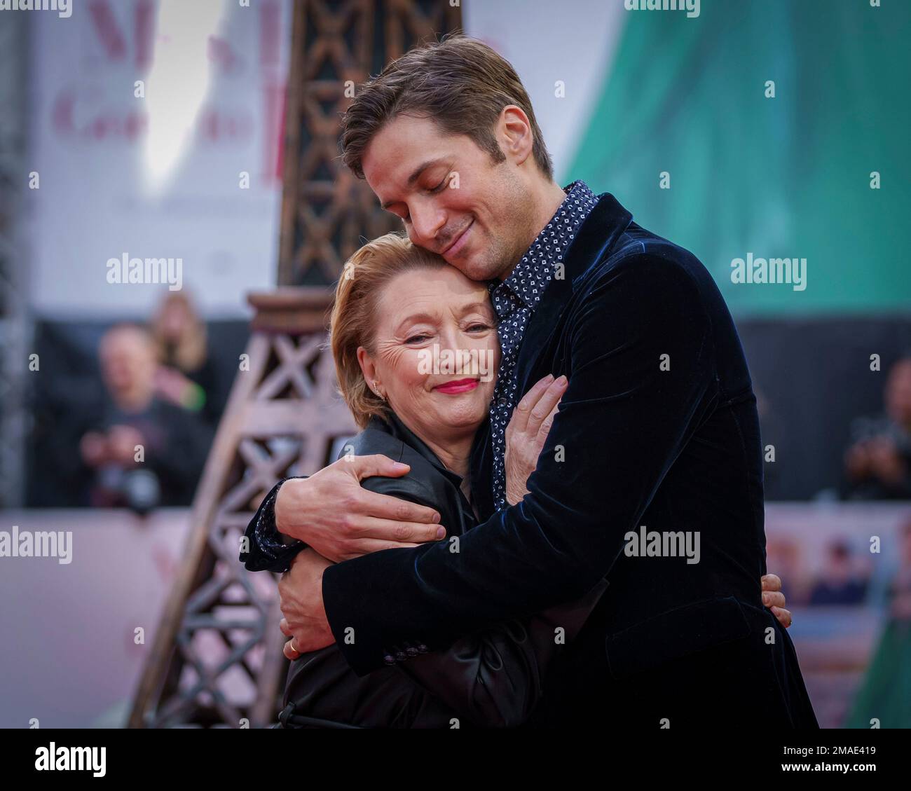 Lesley Manville, left, and Lucas Bravo pose for photographers upon ...