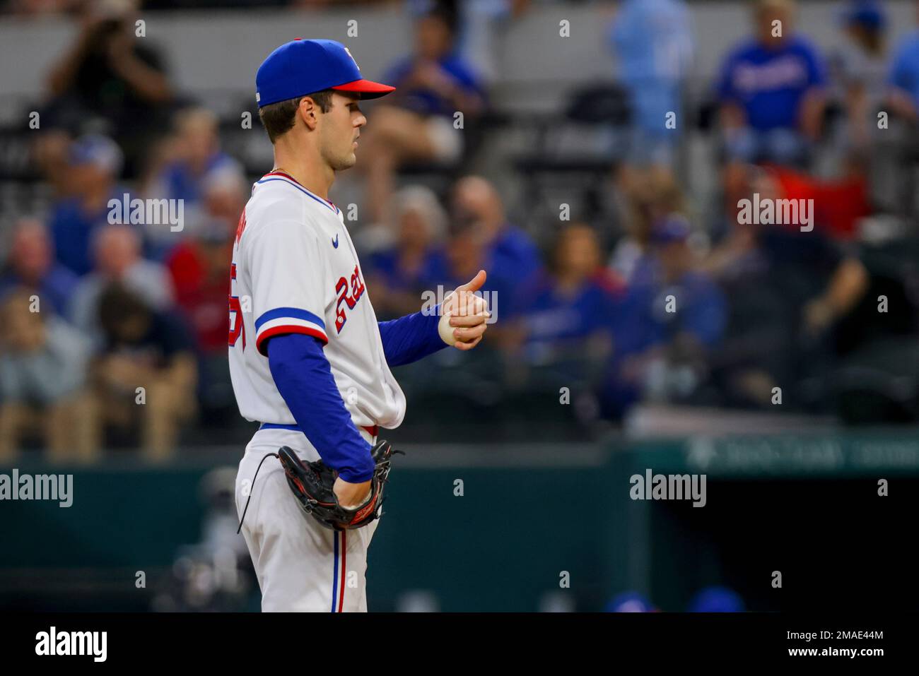 Texas Rangers pitcher Cole Ragans signals to the catcher during the ...