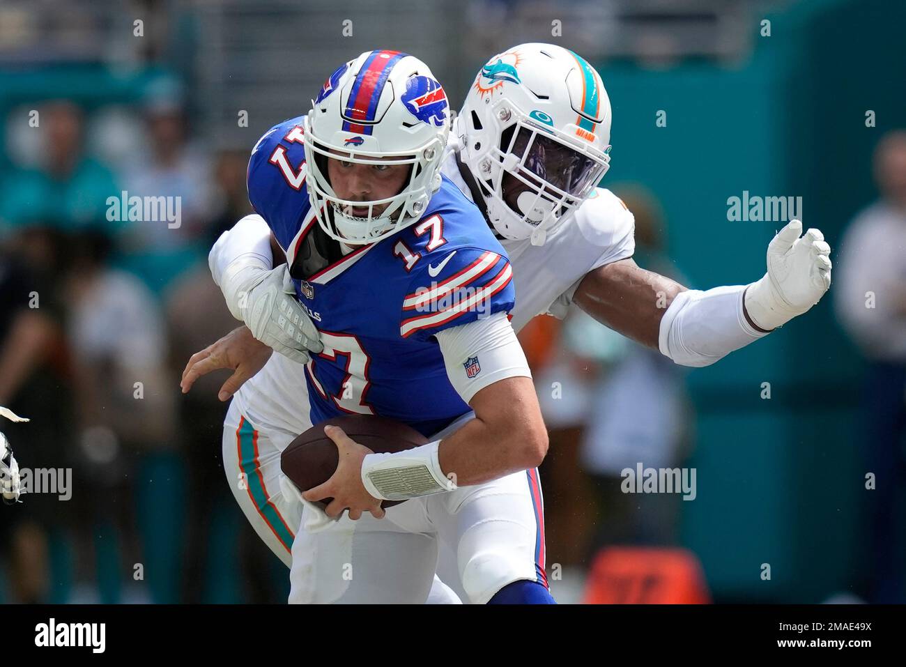 Miami Dolphins defensive end Emmanuel Ogbah (91) grabs Buffalo Bills quarterback Josh Allen (17 ...