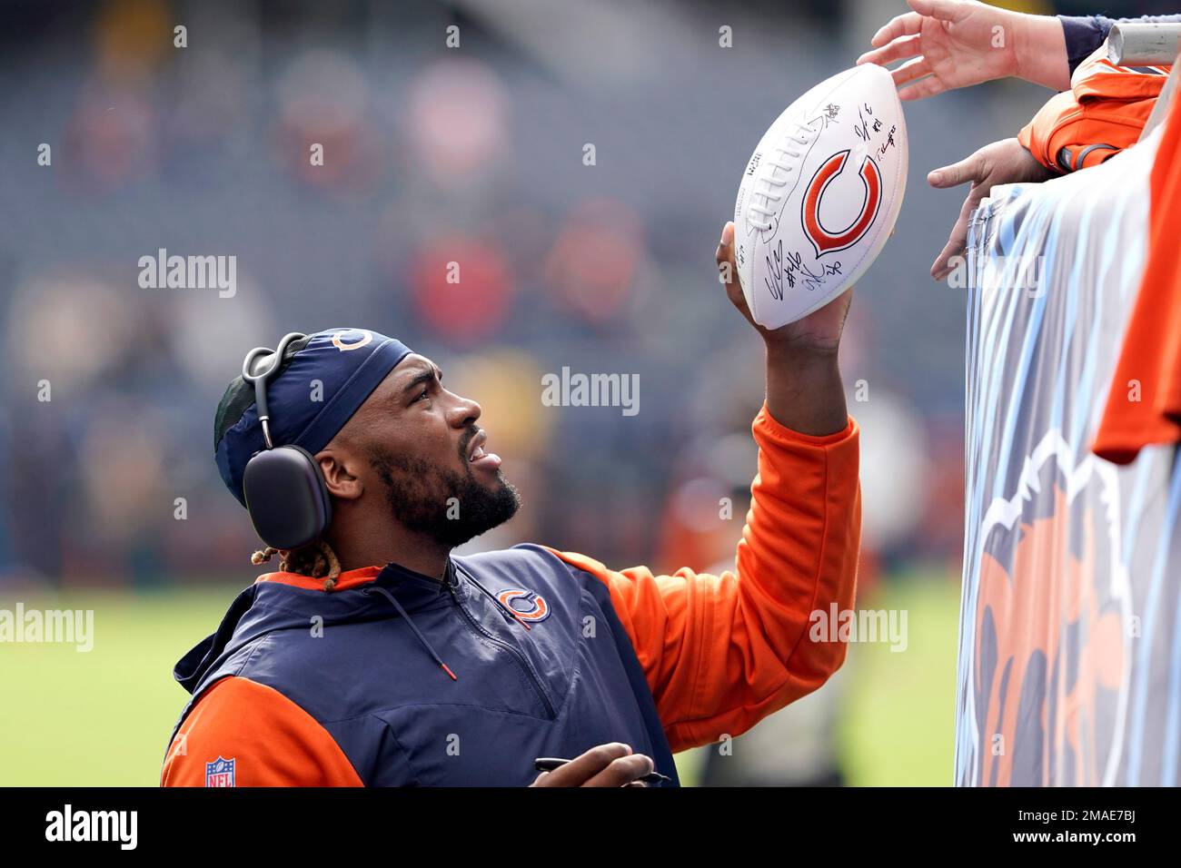 Chicago Bears offensive tackle Braxton Jones signs an autograph before ...