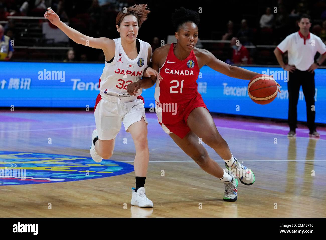 Canada's Nirra Fields, right, runs past Japan's Saori Miyazaki during ...