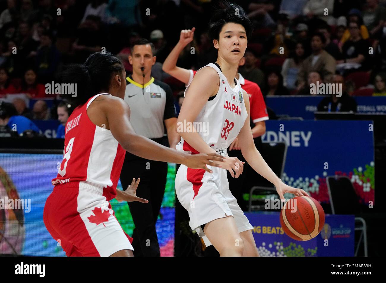 Japan's Himawari Akaho runs at Canada's Shay Colley during their game ...