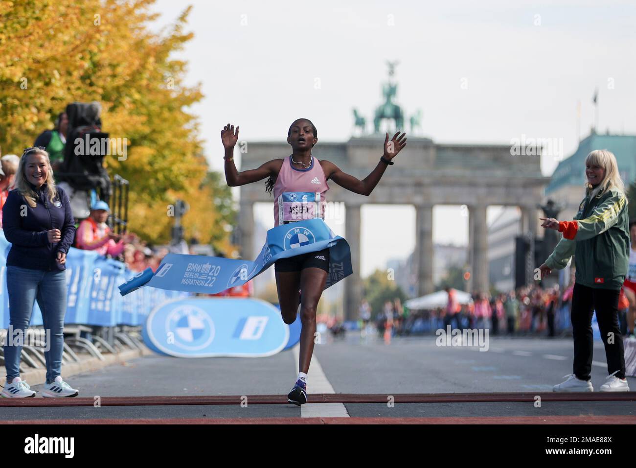 Ethiopia's Tigist Assefa celebrates as she crosses the finish line to ...