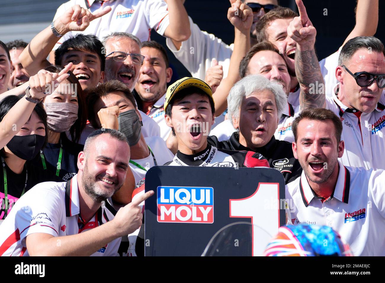 Japanese rider Ai Ogura, center, celebrates with team after winning the ...