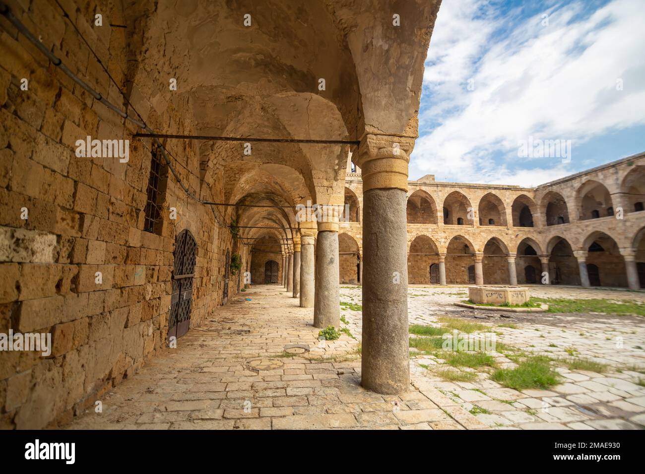 Medieval square building with a courtyard and many arches Stock Photo ...