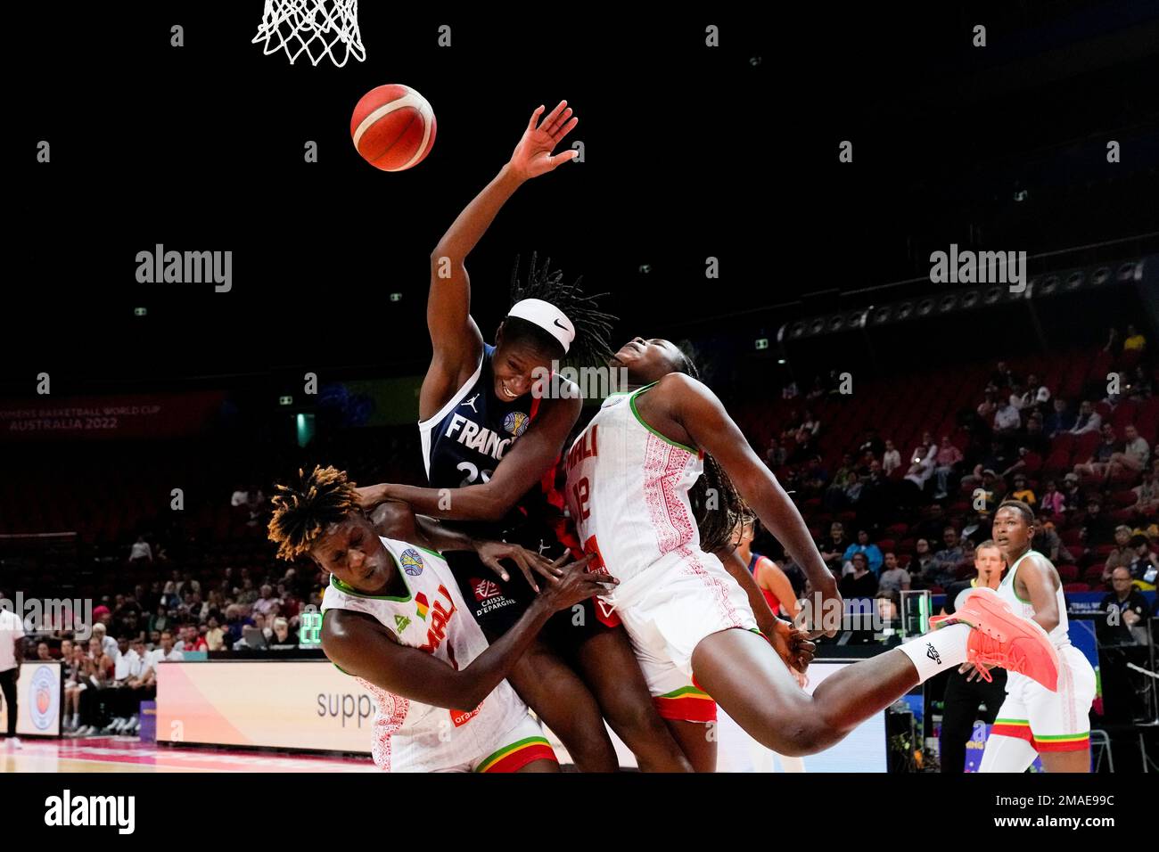 France's Mamignan Toure collides with Mali's Kankou Coulibaly, left ...