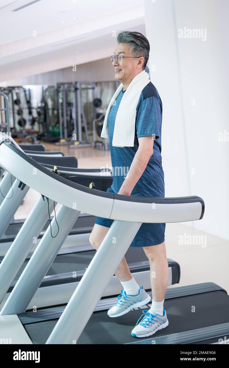 Older man running treadmill hi-res stock photography and images - Alamy