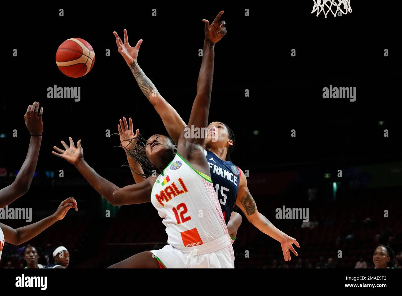Mali's Alima Dembele and France's Gabby Williams, right, compete for ...