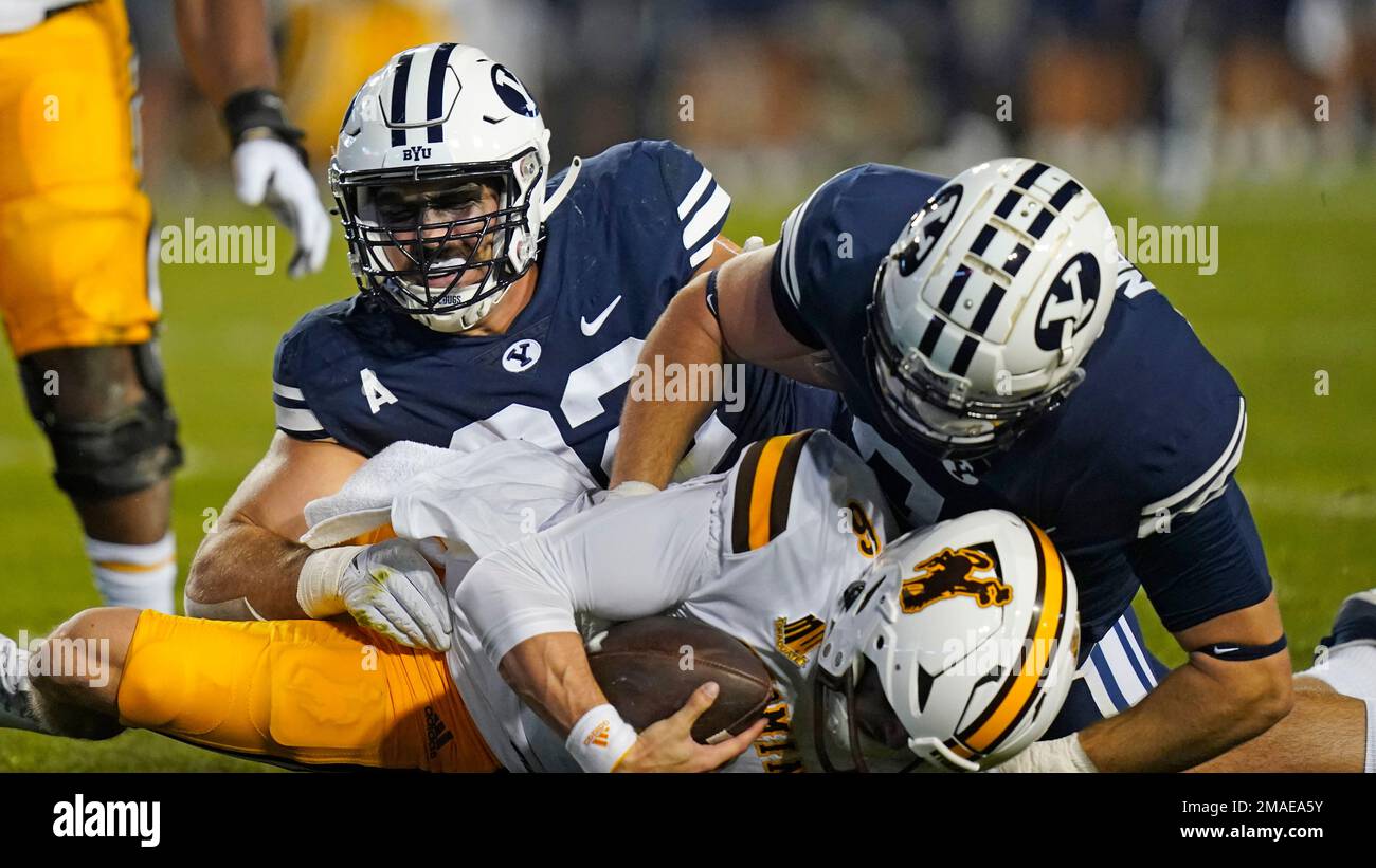 BYU's John Nelson, right, and Tyler Batty, left, sack Wyoming ...