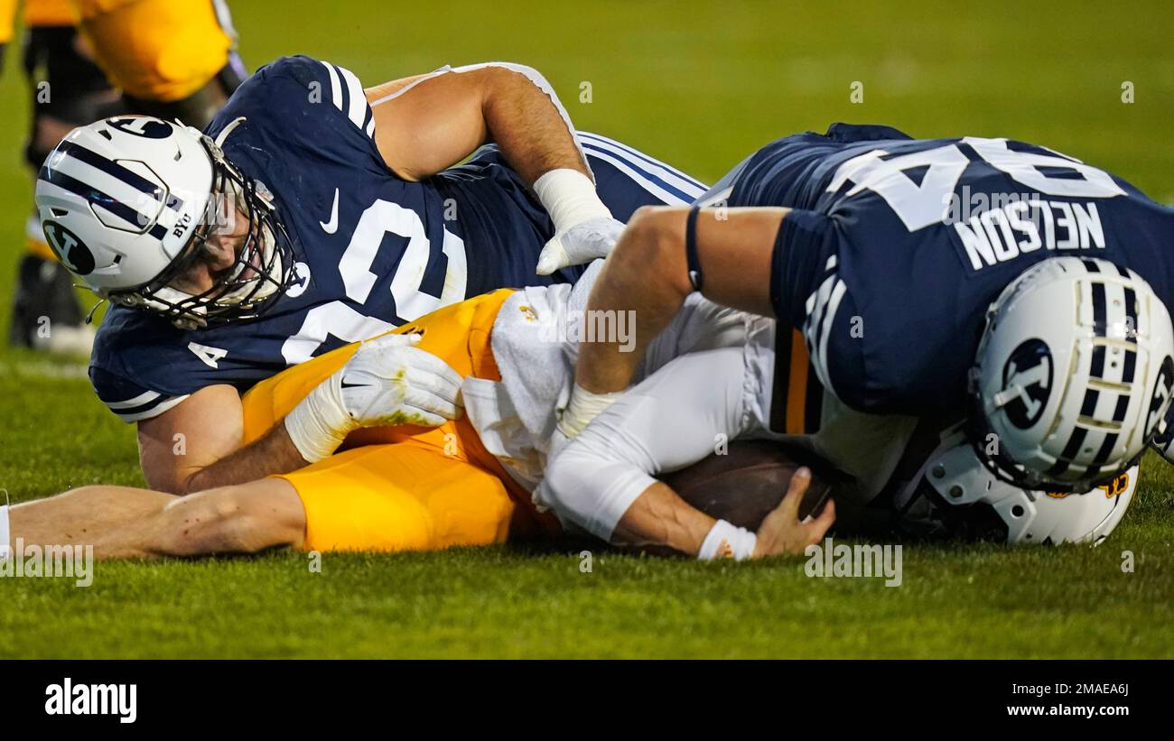 BYU's John Nelson (94) and Tyler Batty, left, sack Wyoming quarterback ...