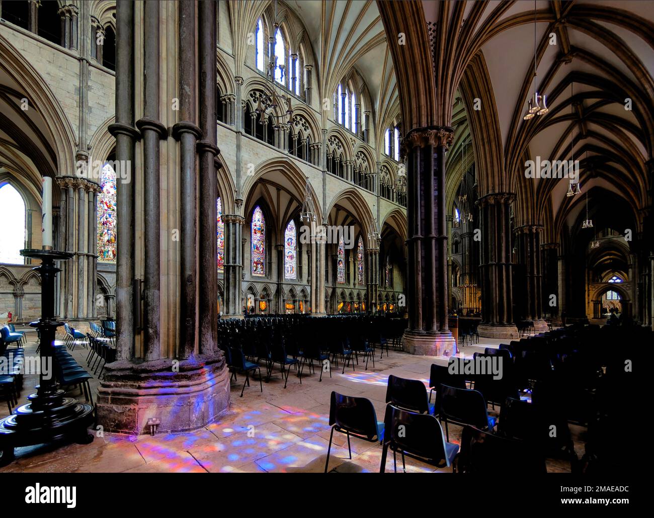 Stained Glass windows producing coloured patterns in a cathedral ...