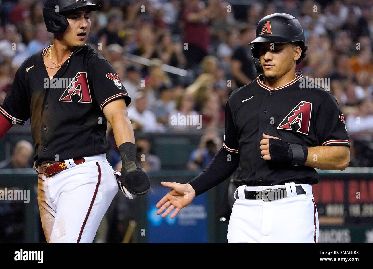 Arizona Diamondbacks' Josh Rojas, left, greets Alek Thomas, right ...