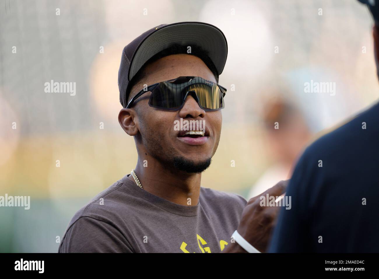 San Diego Padres right fielder Jose Azocar jokes with teammates before ...
