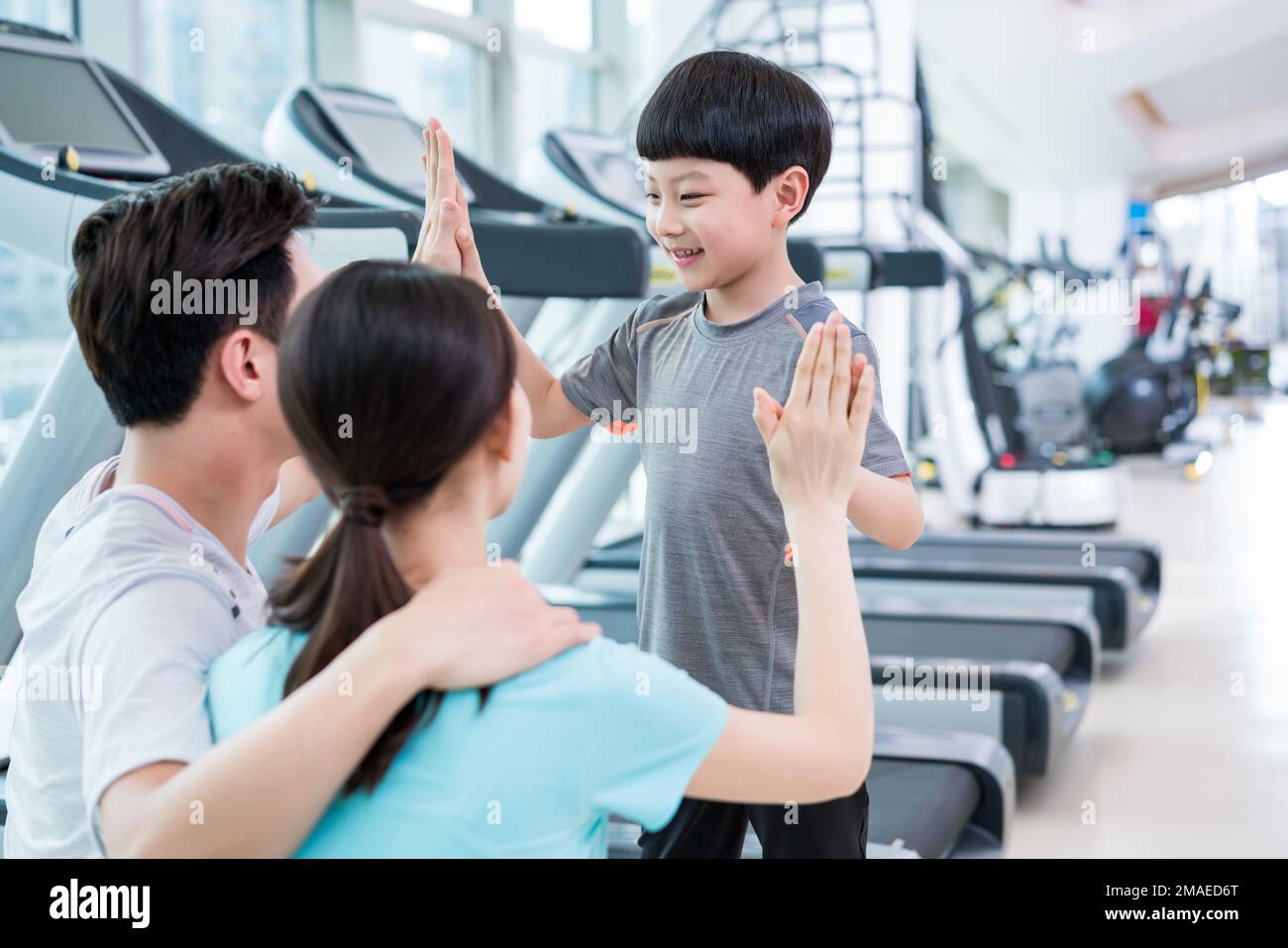 Three in the gym for a workout Stock Photo - Alamy