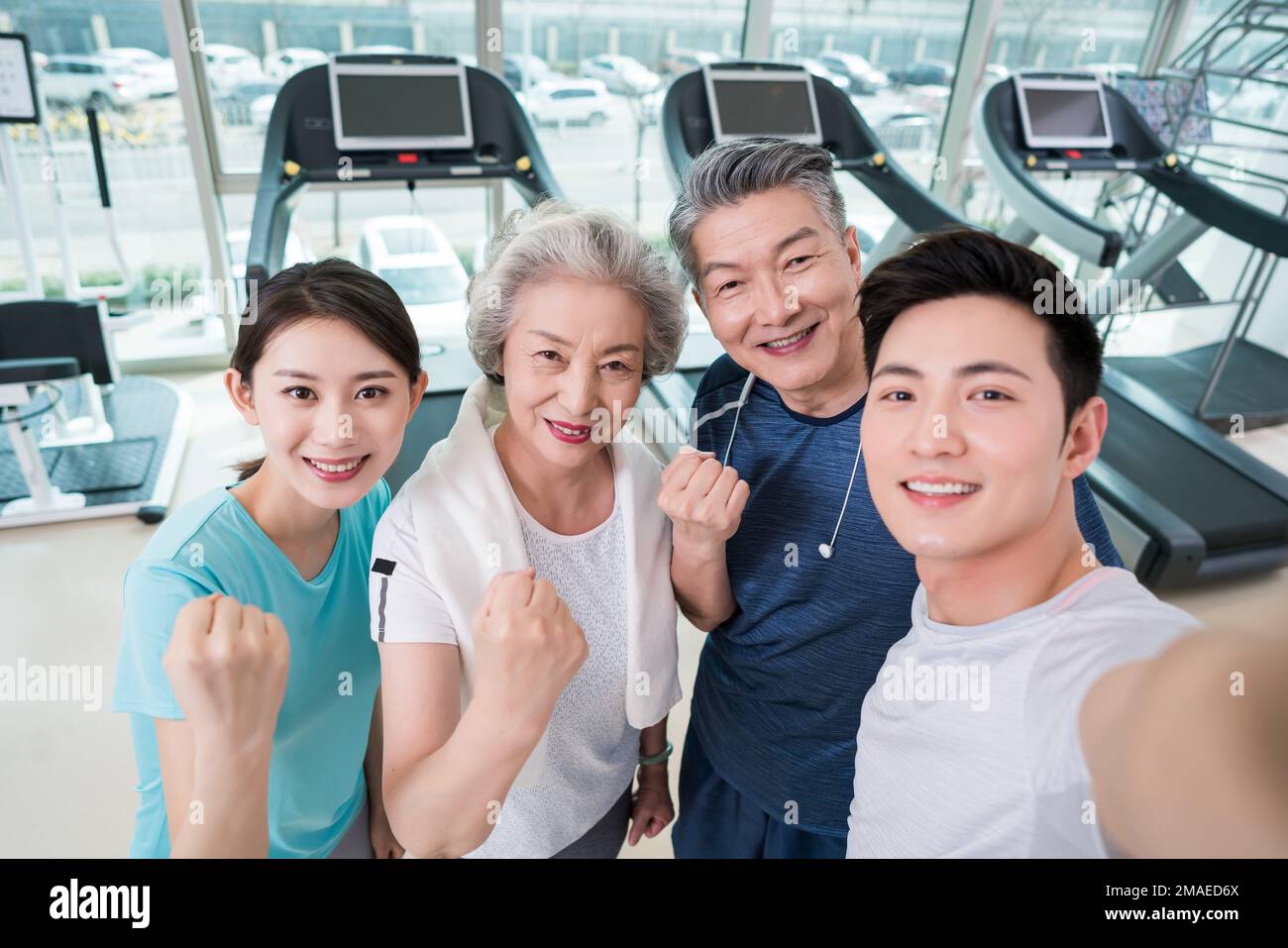 A family of four in the gym Stock Photo - Alamy