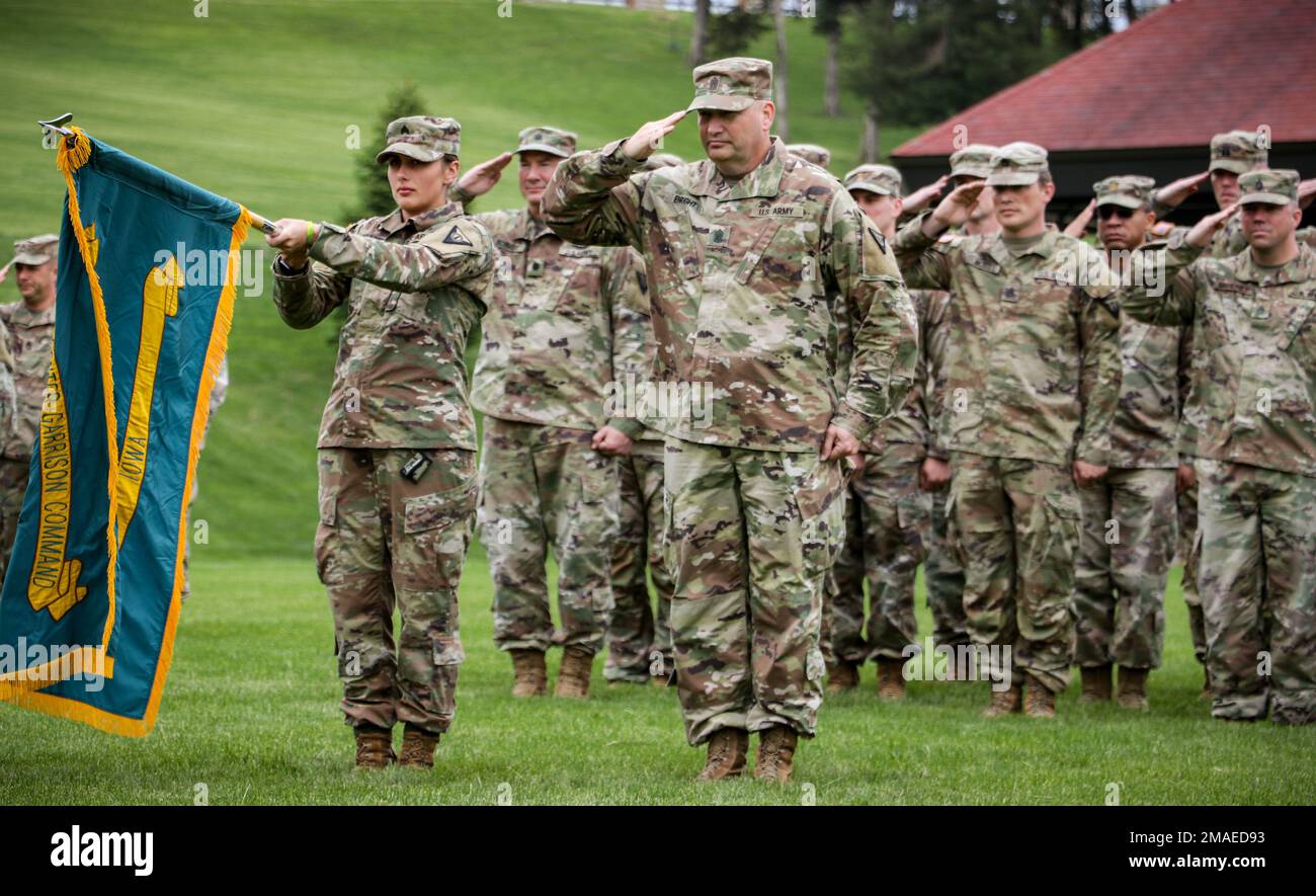 Iowa National Guard Soldiers salute as reveille is played during an ...