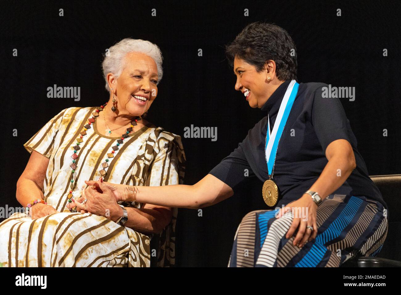 Indra Nooyi, right, former chairman and CEO of PepsiCo, interacts with ...