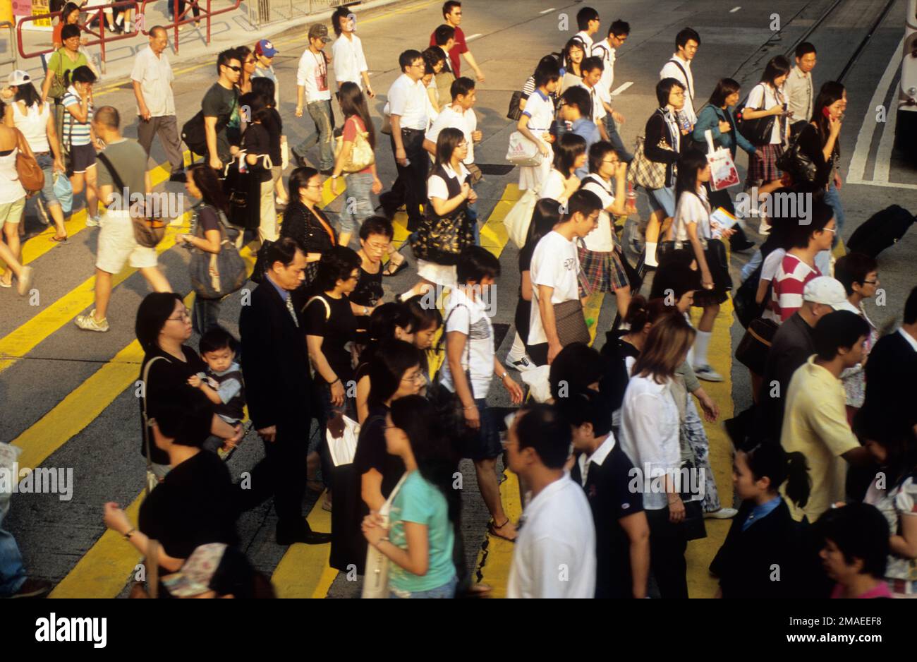 Nov 2006 Hong Kong, HK Island, locals crossing road on 'Zebra' crossing ...