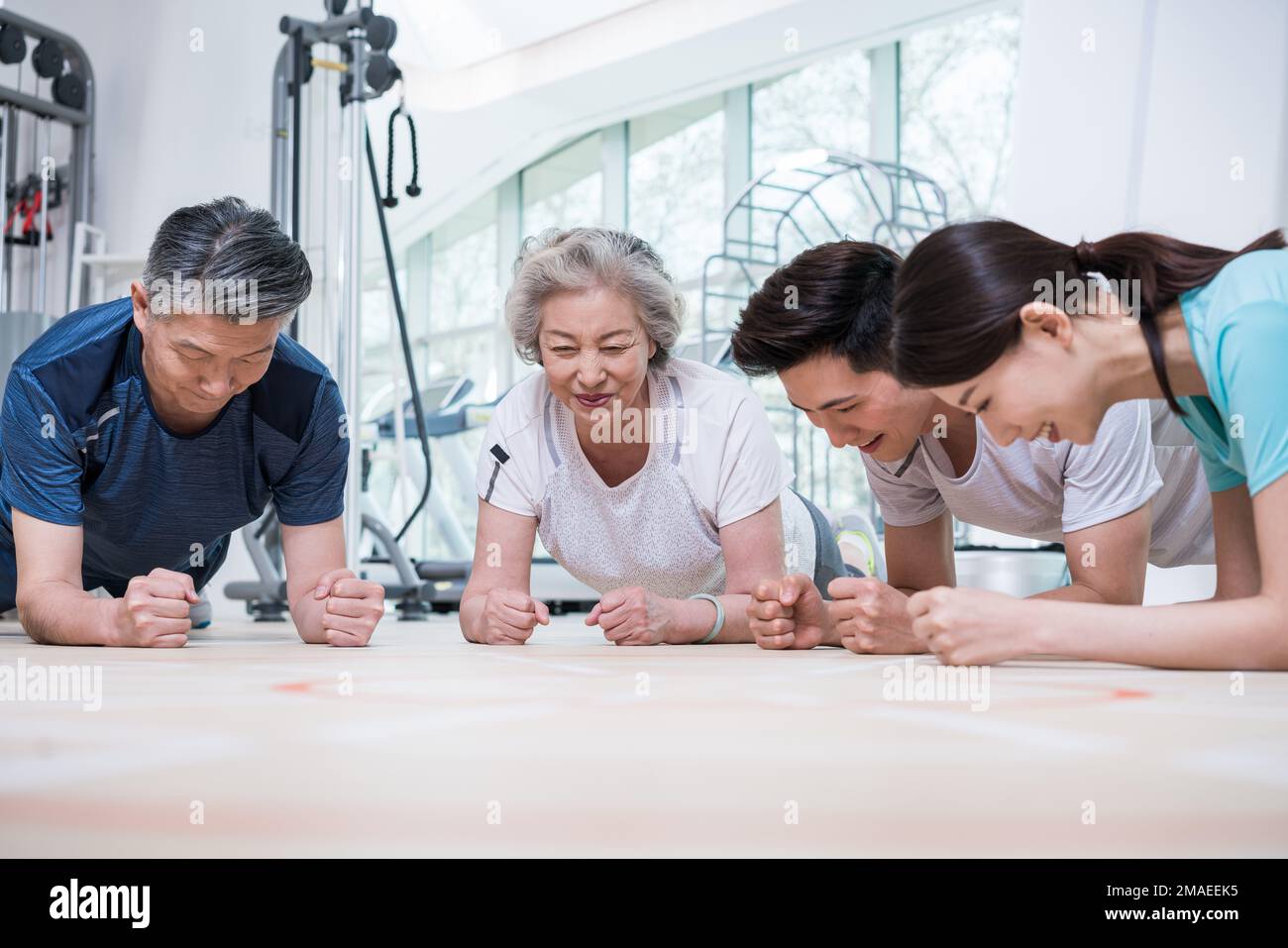 A family of four in the gym Stock Photo - Alamy