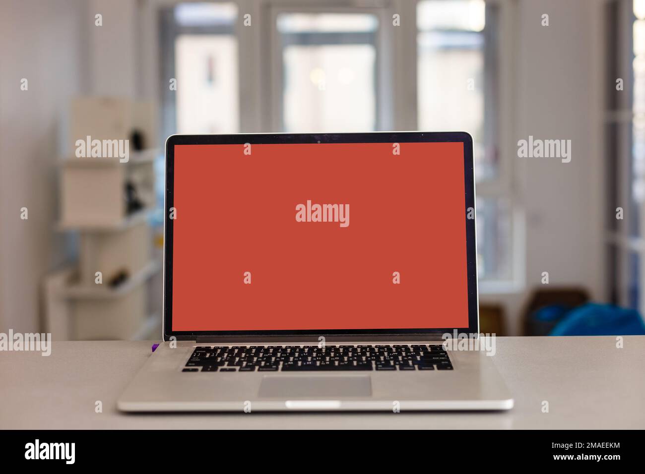 Laptop with blank screen on table Stock Photo - Alamy