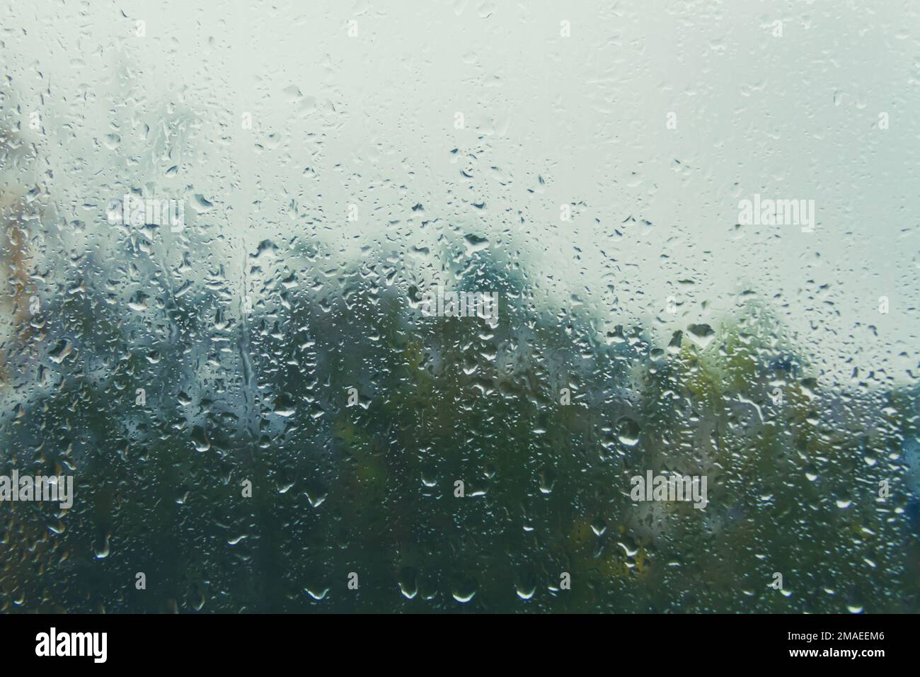 Drops on glass after rain. Autumn weather outside window. Rain outside ...