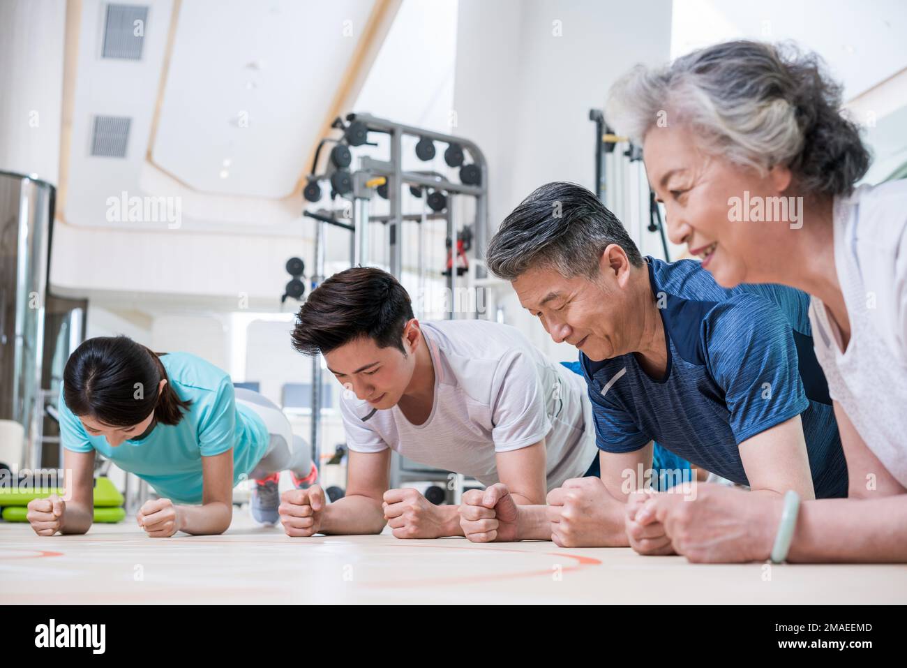 A family of four in the gym Stock Photo - Alamy