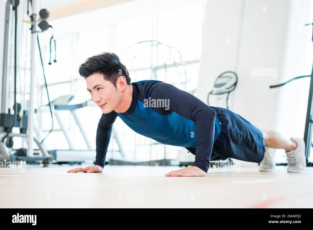 The young man to do push-ups Stock Photo - Alamy