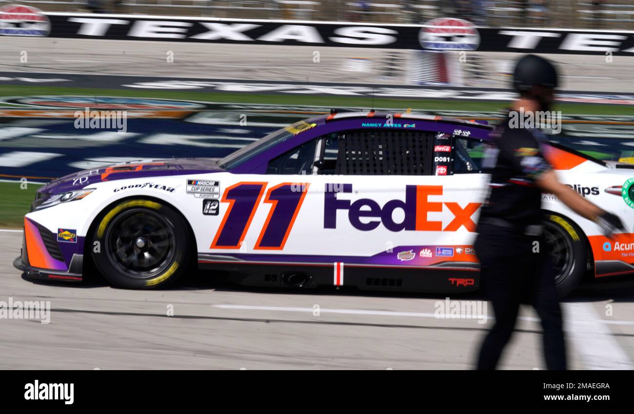 Denny Hamlin (11) drives on pit row during practice for the NASCAR Cup ...