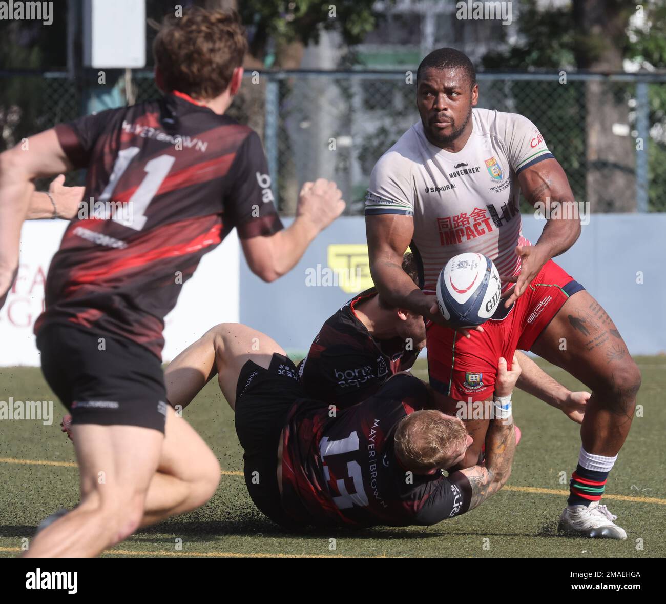 #12 Sibusiso Sithole of Sandy Bay is tackled by a Valley player during ...