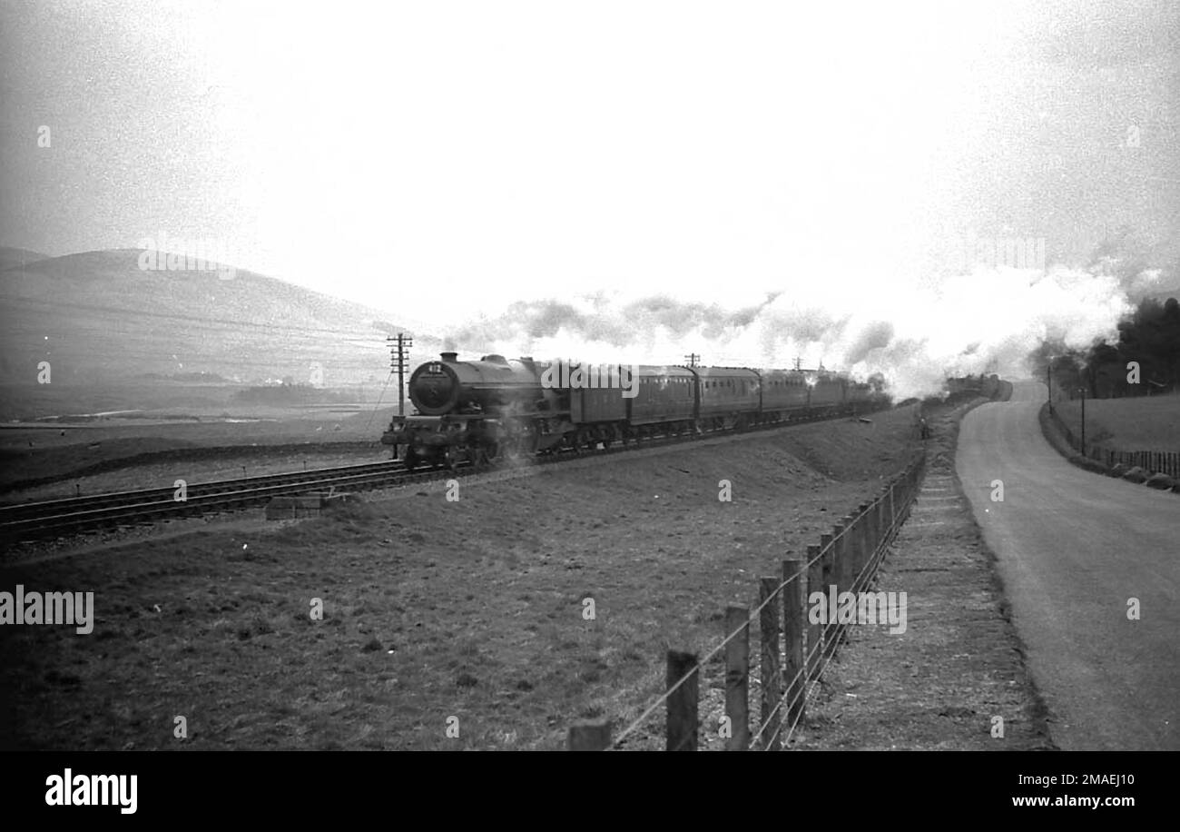 An LMS 4-6-2 Pacific locomotive hauls an Up express train near Wandel ...