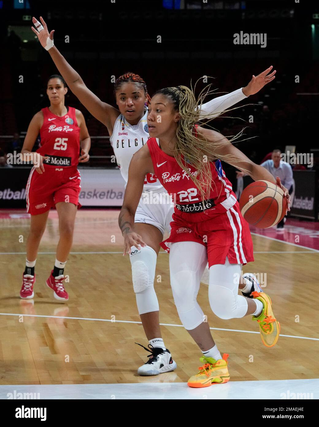 Puerto Rico's Arella Guirantes runs past Belgium's Maxuella Lisowa ...