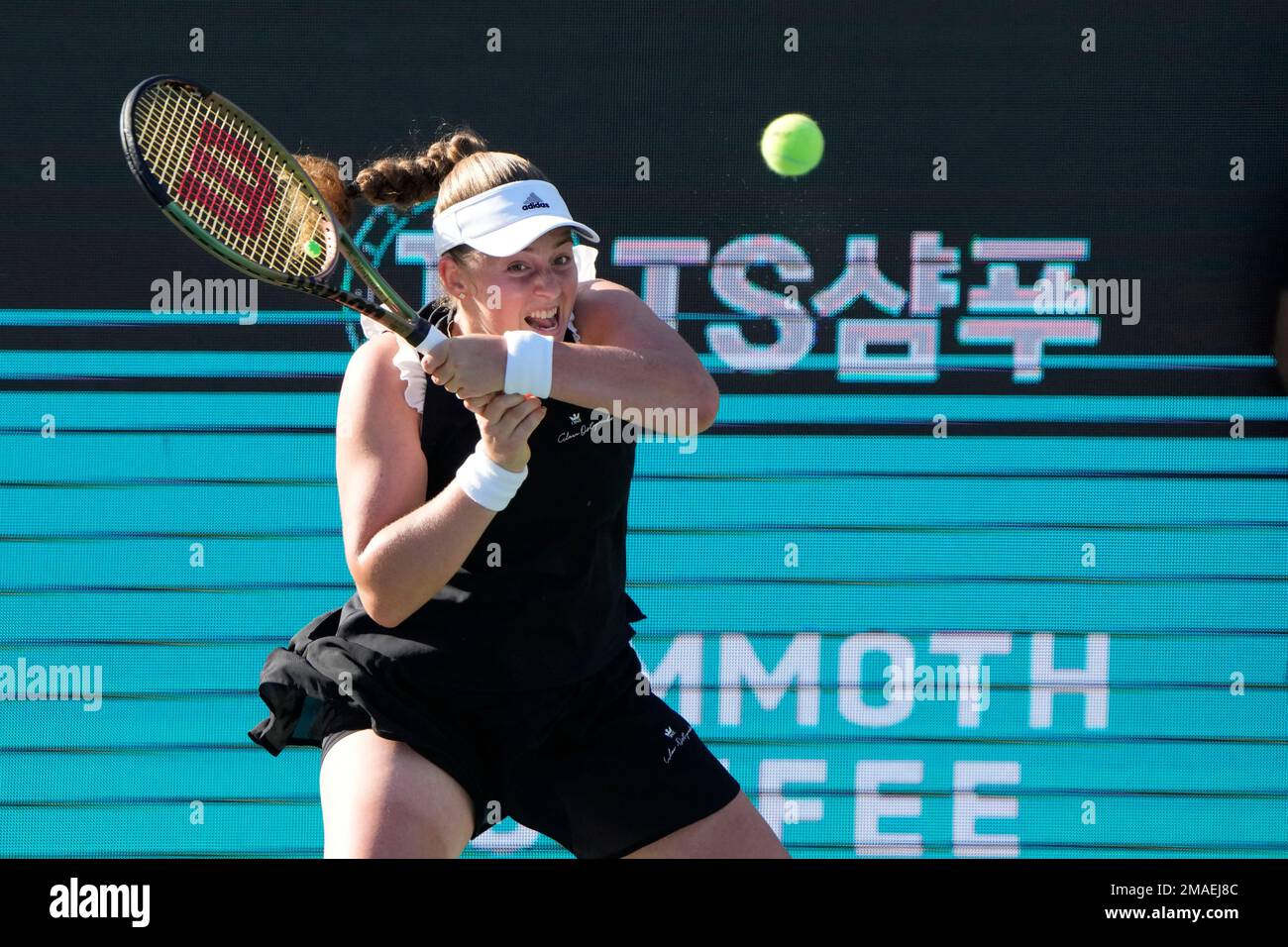 Jelena Ostapenko of Latvia returns a shot to Emma Raducanu of Britain ...