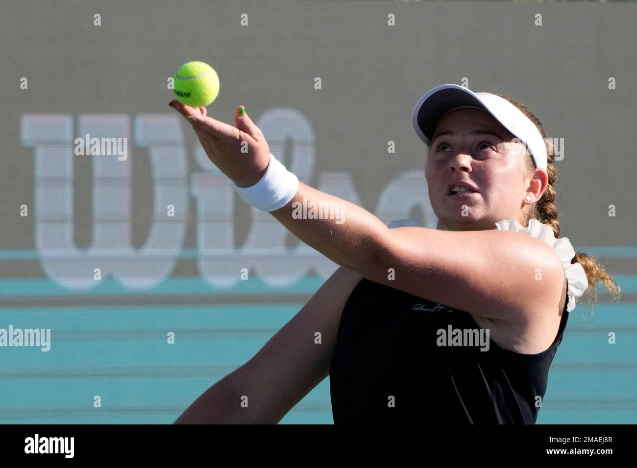 Jelena Ostapenko of Latvia serves to Emma Raducanu of Britain during ...