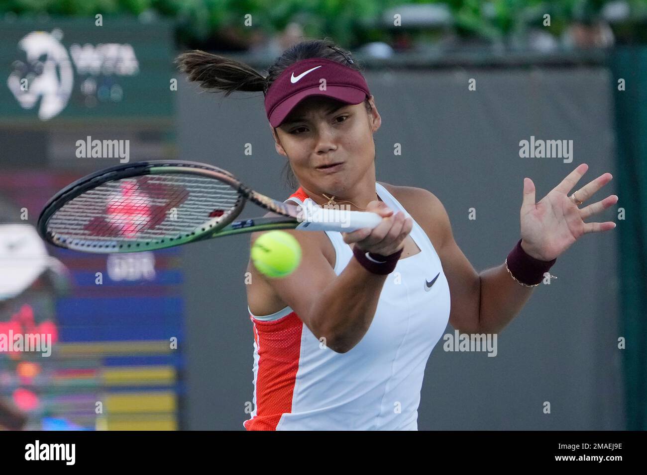 Emma Raducanu of Britain returns a shot to Jelena Ostapenko of Latvia ...