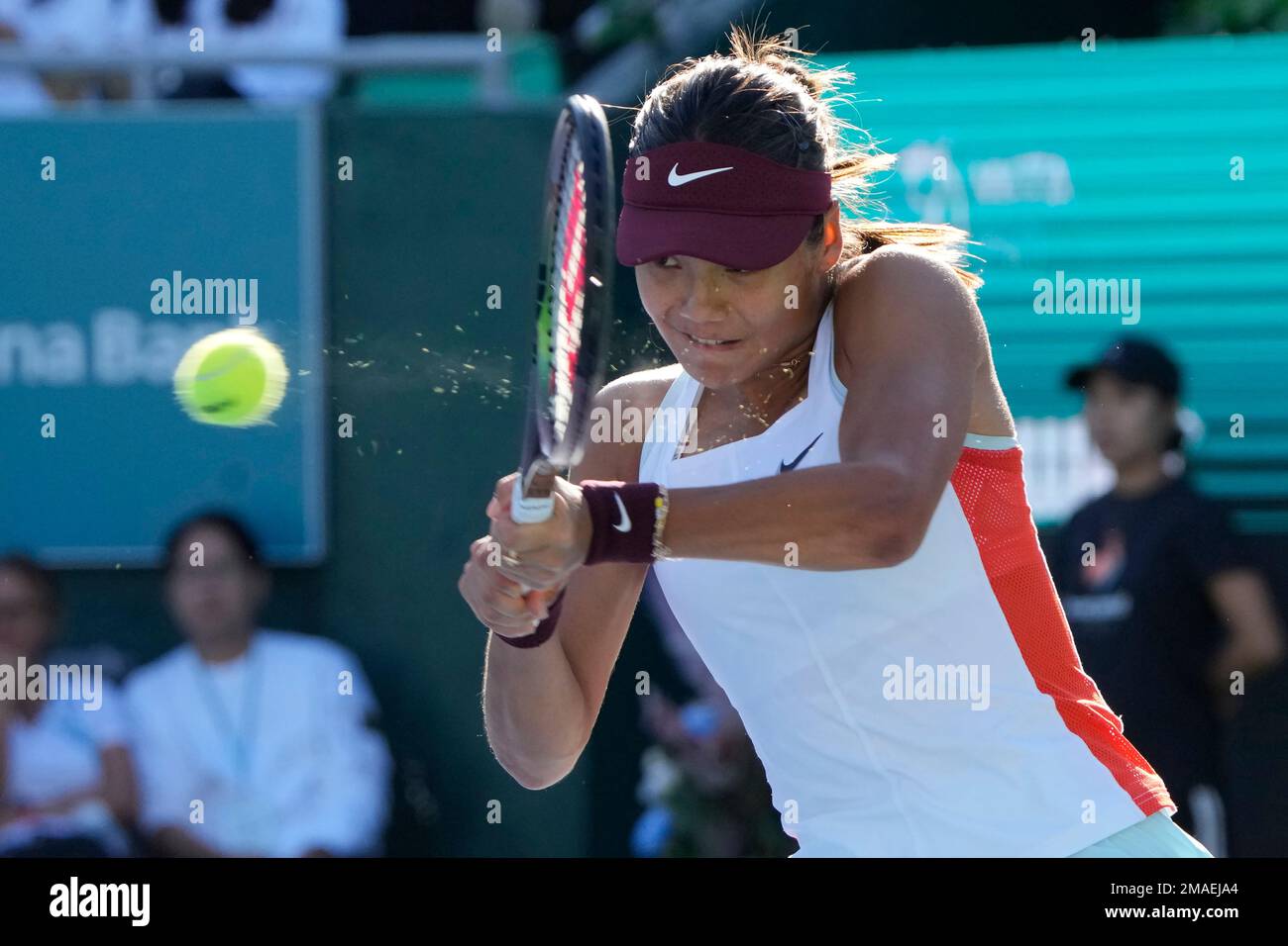 Emma Raducanu of Britain returns a shot to Jelena Ostapenko of Latvia ...