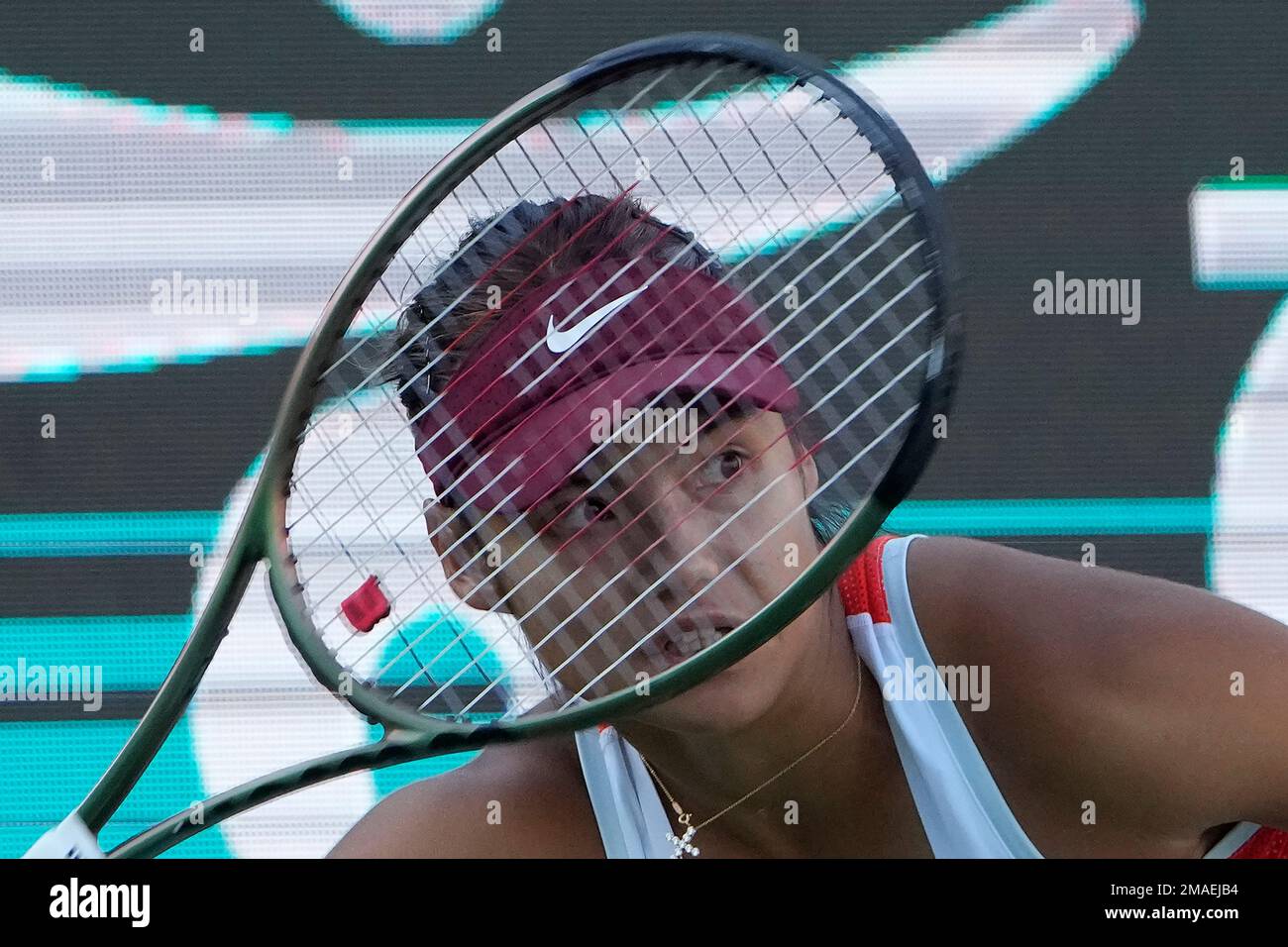Emma Raducanu of Britain returns a shot to Jelena Ostapenko of Latvia ...
