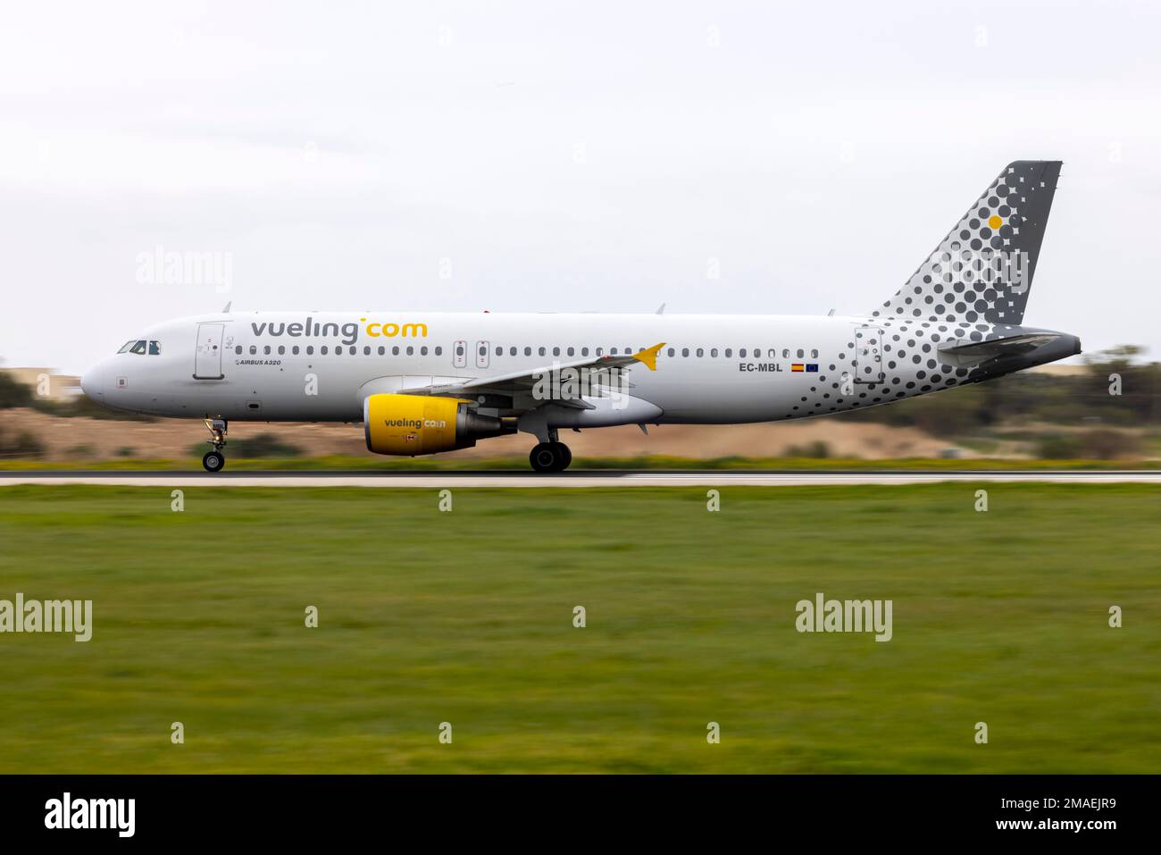 Vueling Airlines Airbus A320-214 (REG: EC-MBL) starting its take off run from runway 31 Stock ...