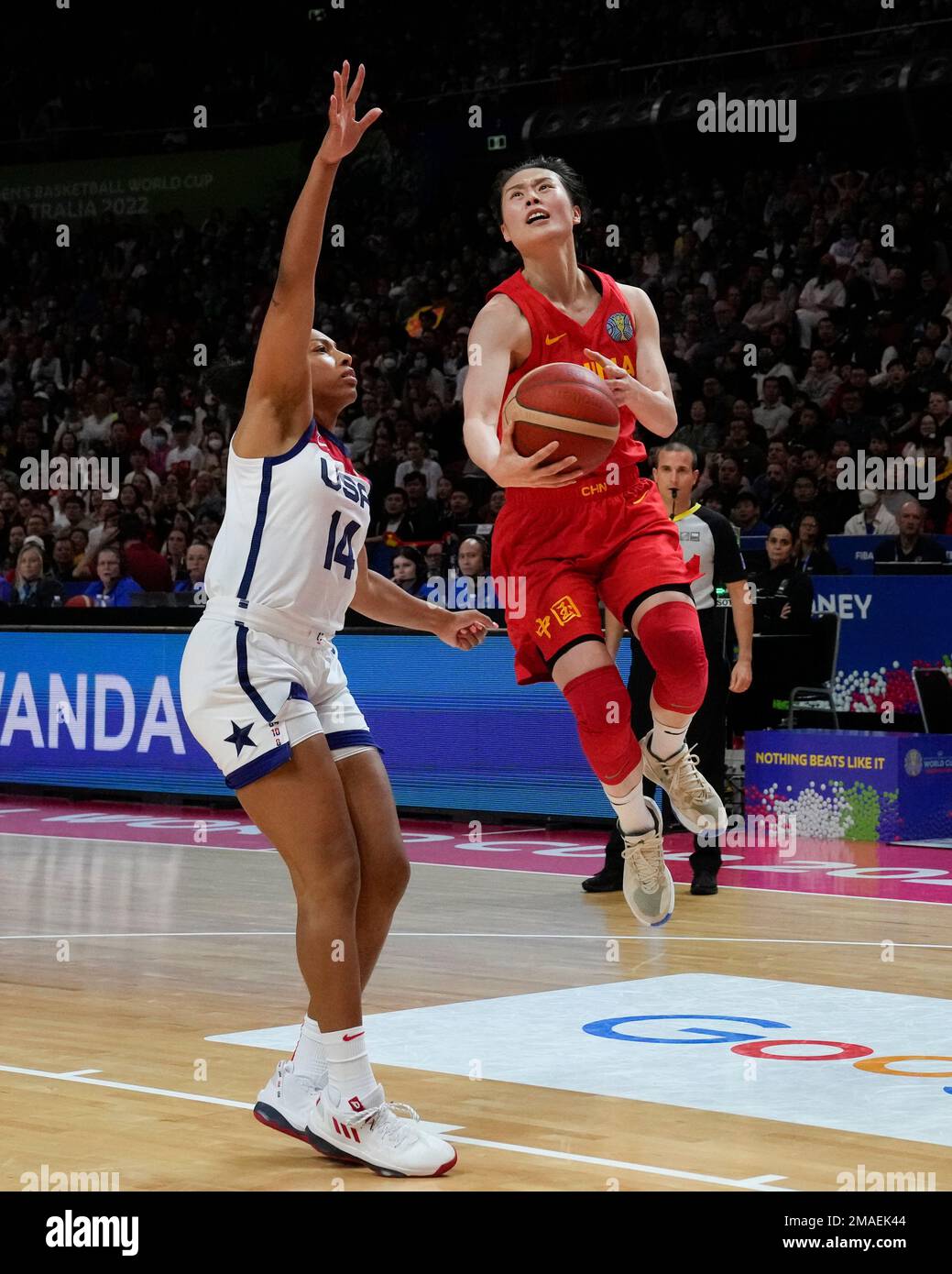 China's Wang Siyu runs past United States' Betnijah Laney to score a ...