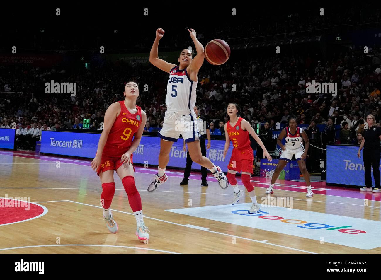 United States' Kelsey Plum, right, and China's Li Meng compete for the ...