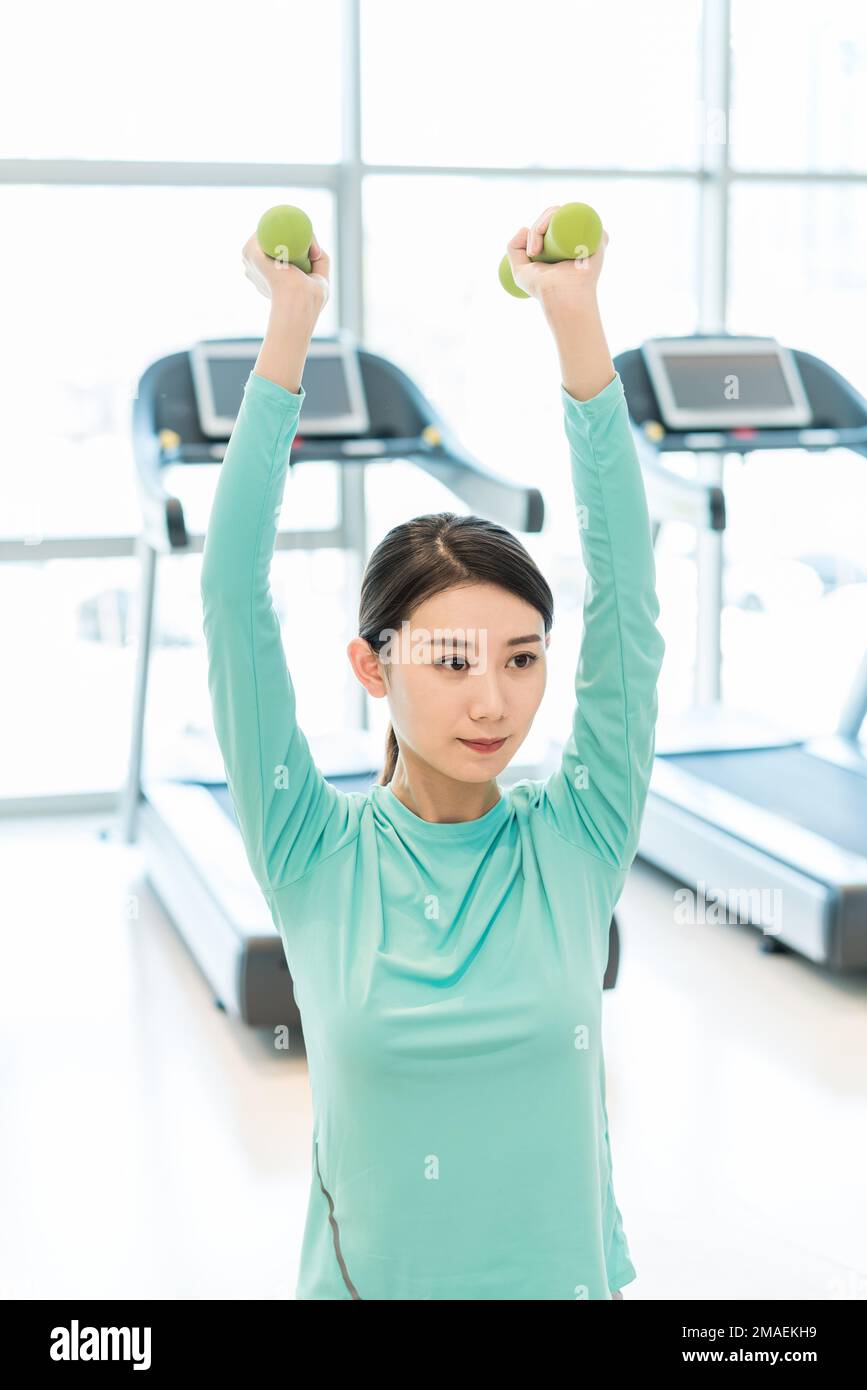 A young woman in the gym for a workout Stock Photo - Alamy