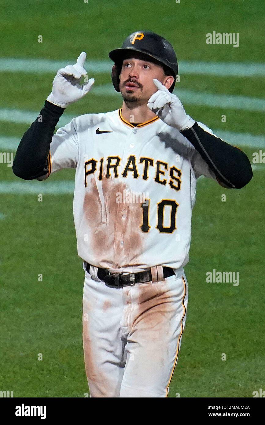 Pittsburgh Pirates' Bryan Reynolds crosses home plate after hitting a ...