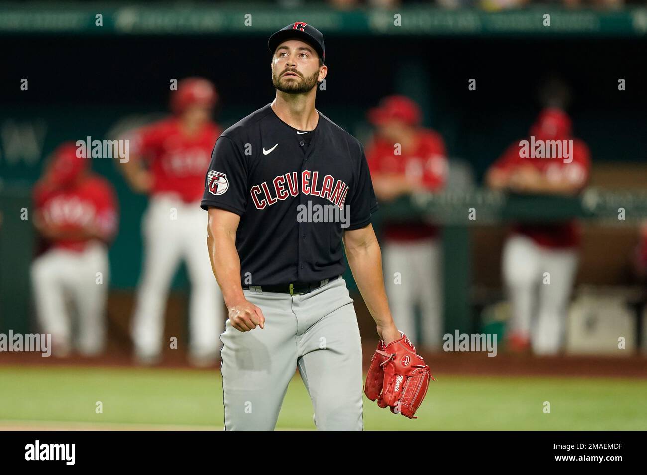 Cleveland Guardians starting pitcher Cody Morris walks to the dugout ...