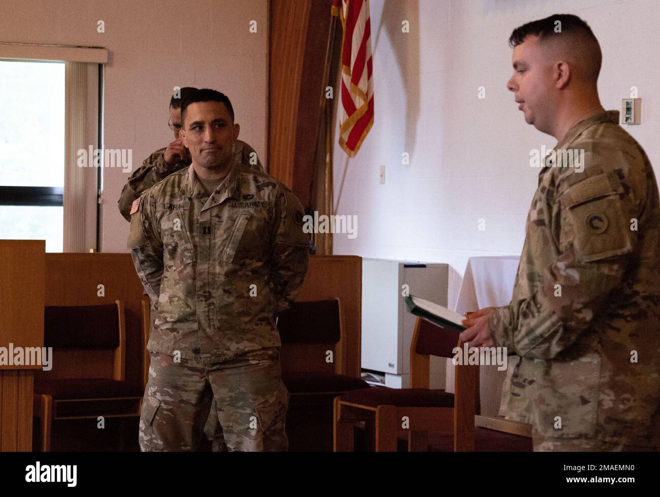 Capt. Marco Lara (left), company commander, Headquarters and ...
