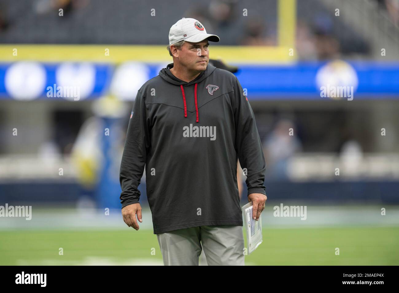 Atlanta Falcons director of coaching operations Brian Griffin walks on ...