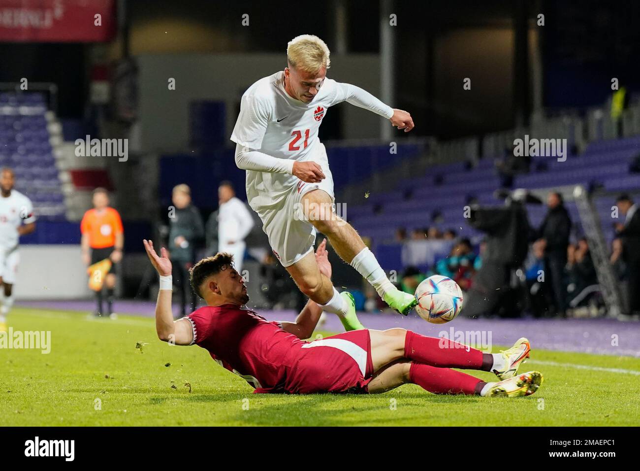 Qatar's Alrawi, tries tp stop Canada's Liam Millar during the ...