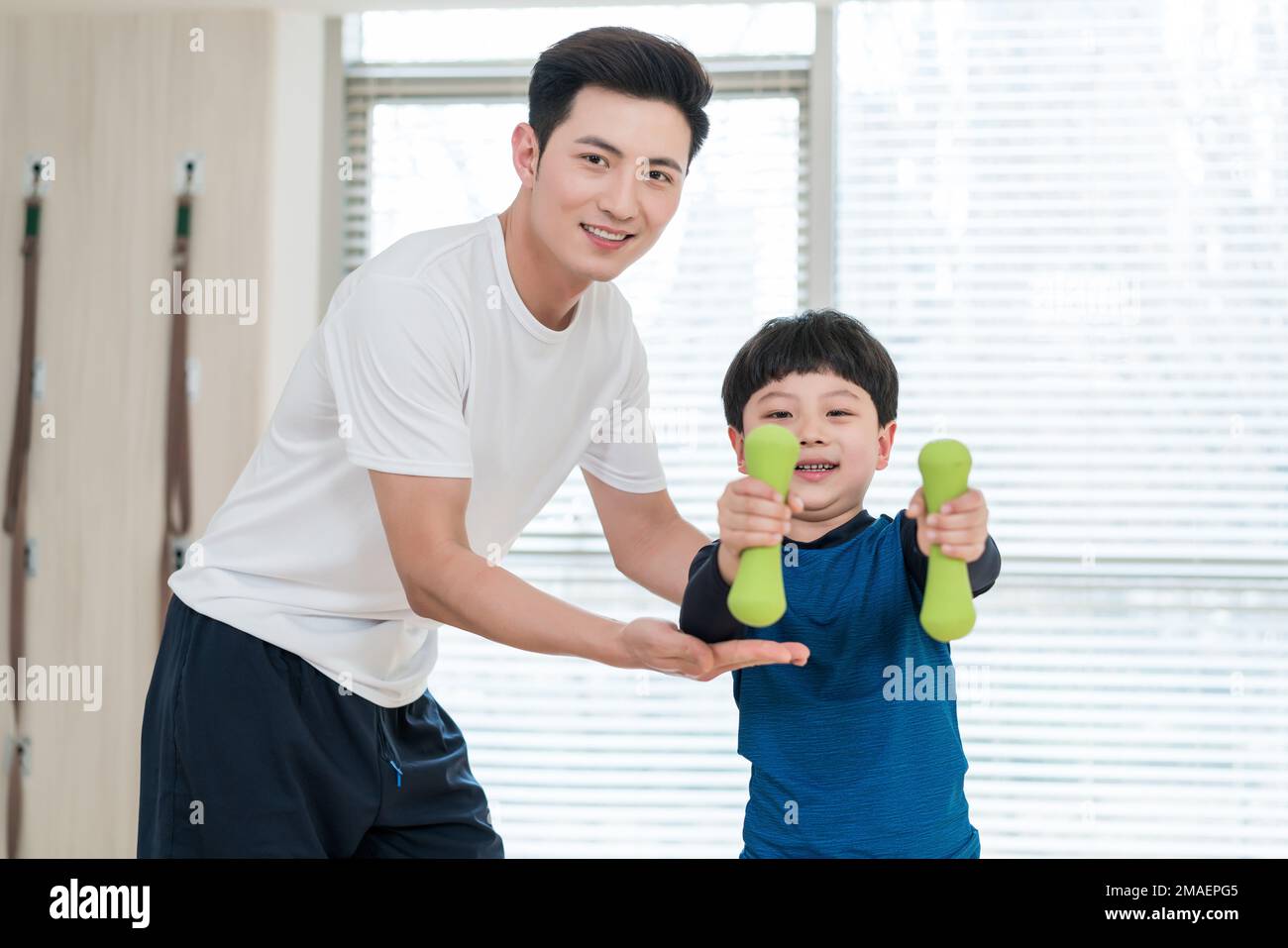 Father and son in the gym Stock Photo - Alamy